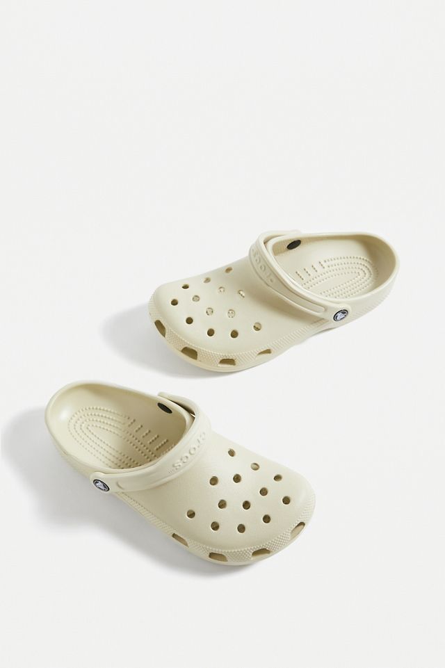 Crocs Bone Classic Clogs | Urban Outfitters UK