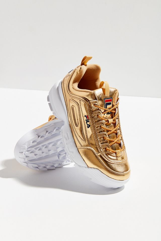 FILA Disruptor II Premium Metal Gold Trainers | Urban Outfitters UK