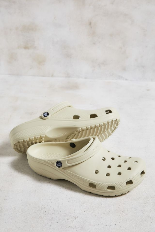 Crocs Bone Classic Clogs | Urban Outfitters UK