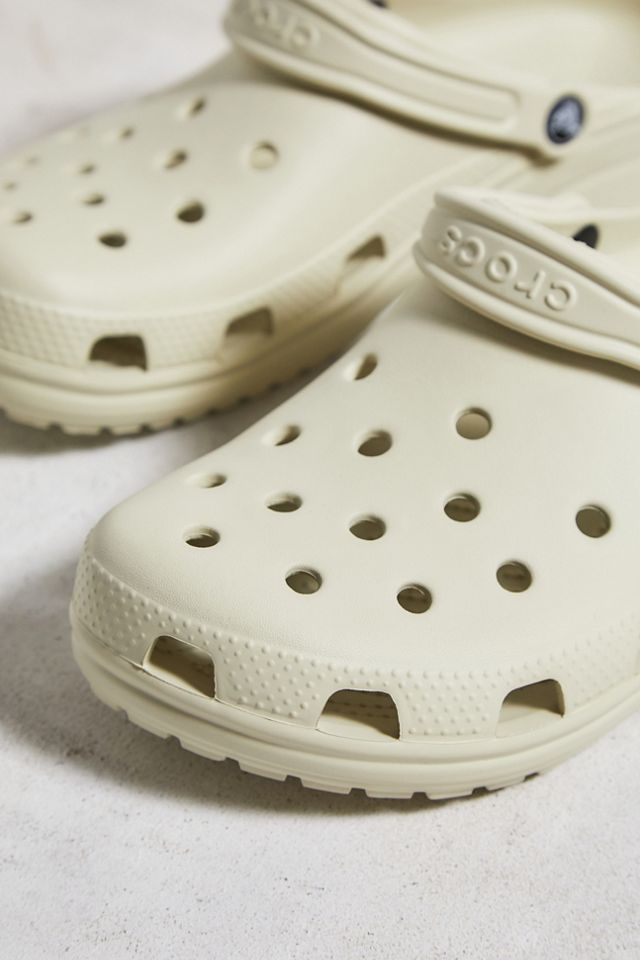 Crocs Bone Classic Clogs | Urban Outfitters UK
