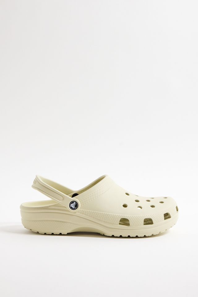 Crocs Bone Classic Clogs | Urban Outfitters UK