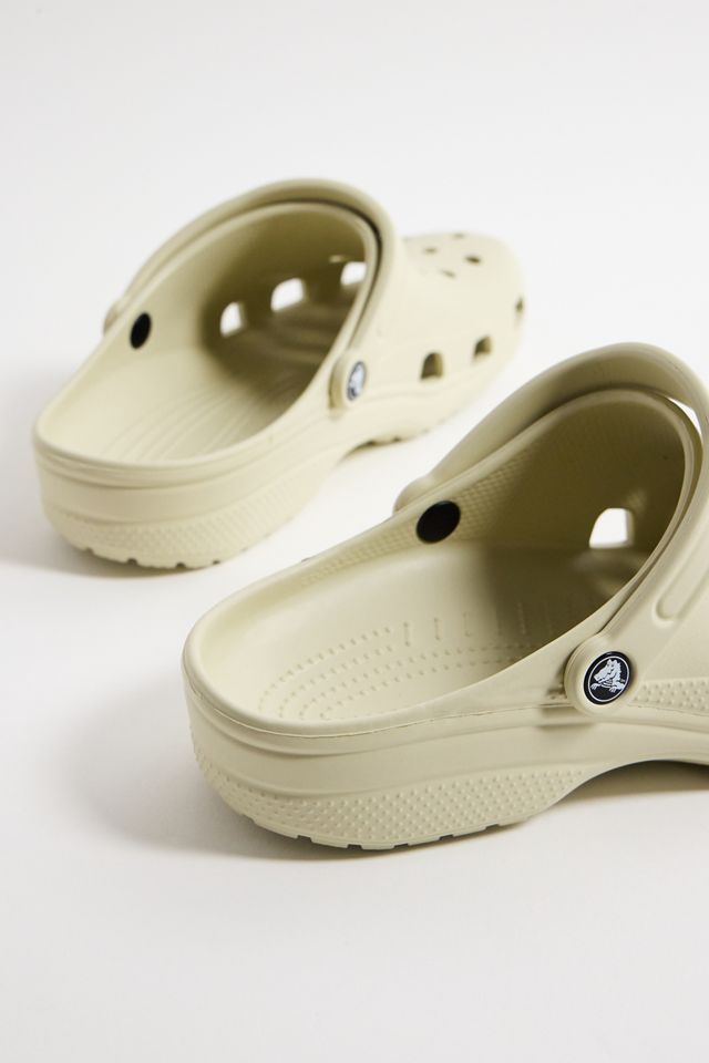 Crocs Bone Classic Clogs | Urban Outfitters UK
