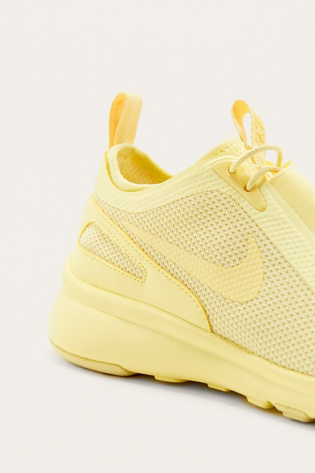 Nike Current Yellow Slip-On Trainers | Urban Outfitters UK
