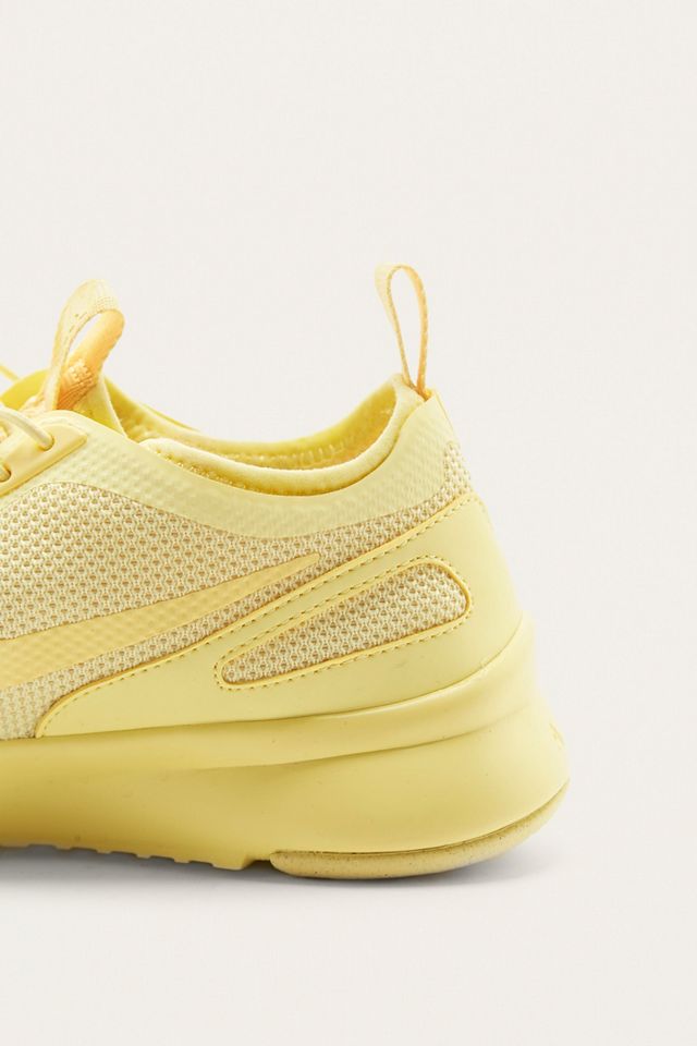 Nike Current Yellow Slip-On Trainers | Urban Outfitters UK